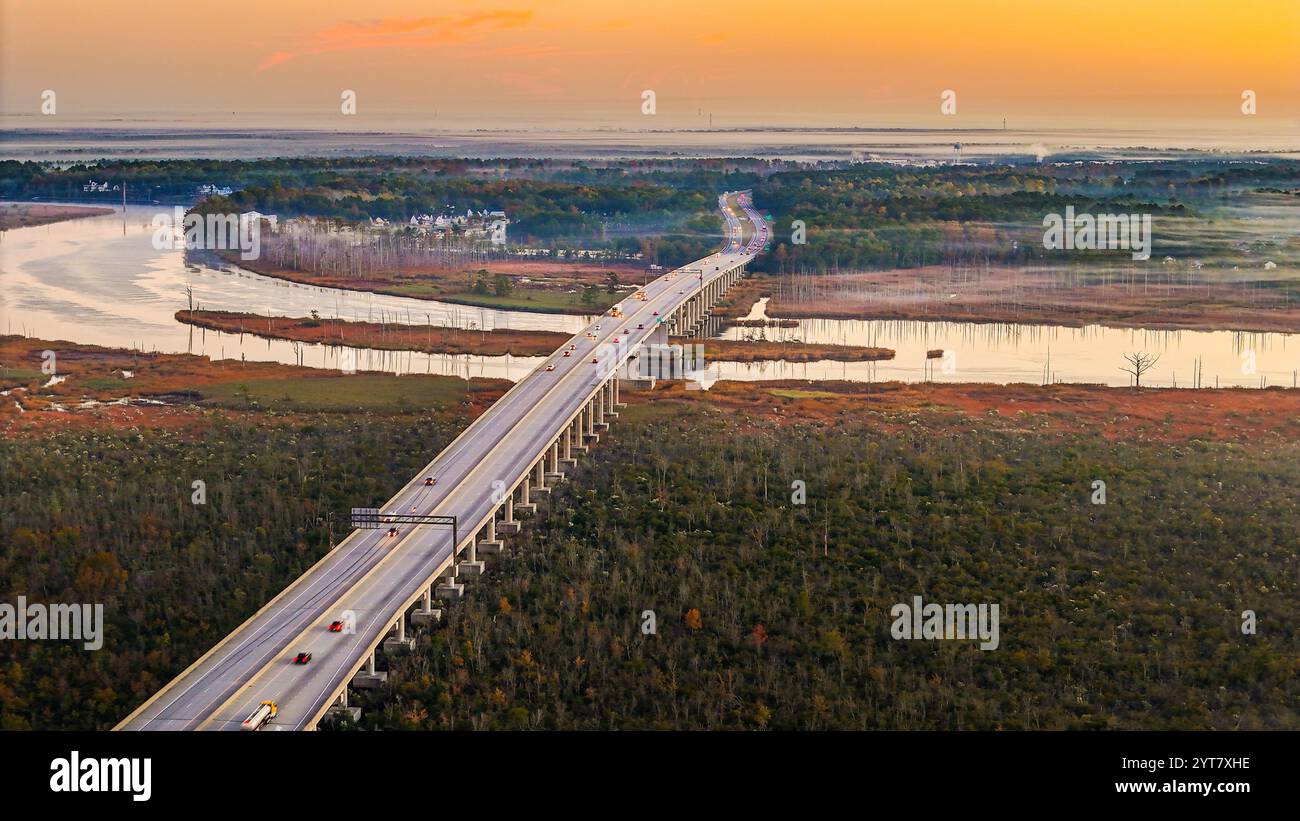 An aerial view of the highway going over the river. Drone shot at ...