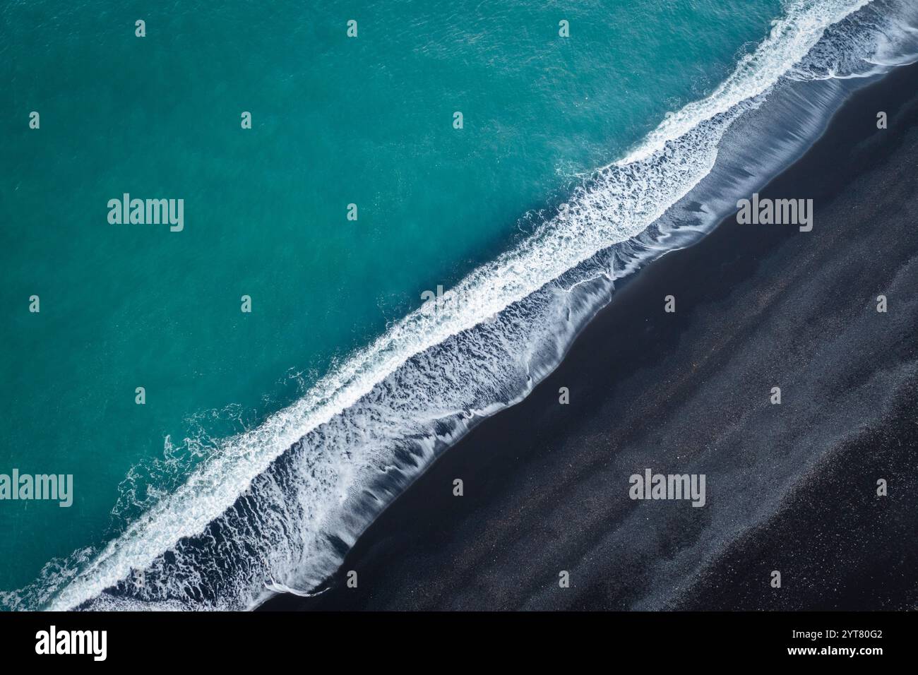Aerial view of waves on the black sands of Reynisfjara beach. V'k ...