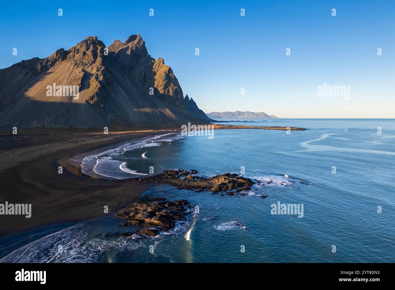 Aerial view of the black sand dunes in front of Vestrahorn mountain ...