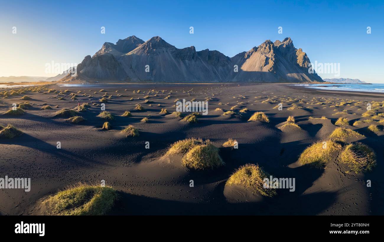 Aerial view of the black sand dunes in front of Vestrahorn mountain ...