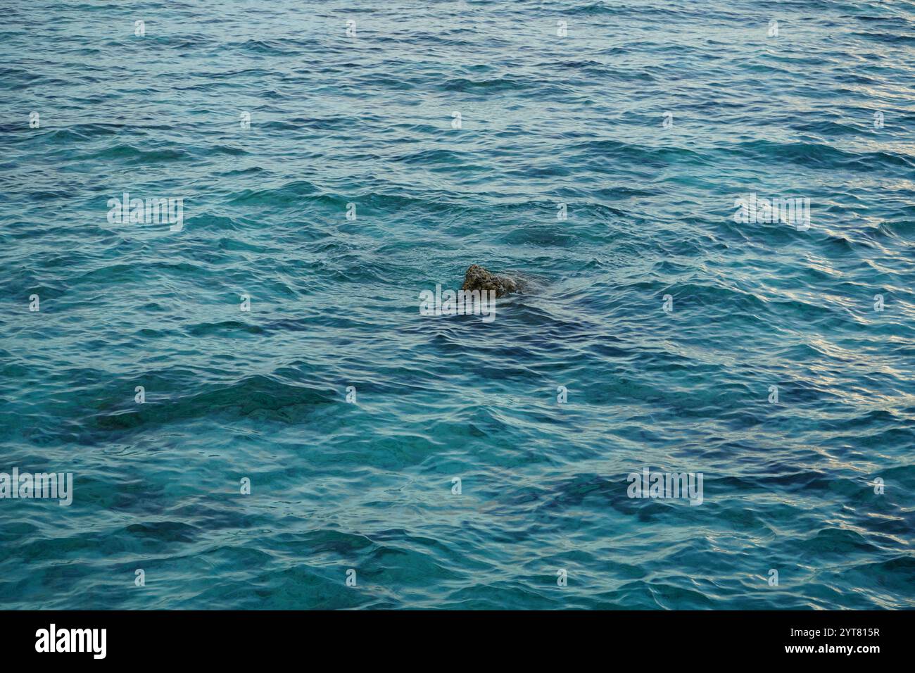 Waves Over Rock Stock Photo - Alamy