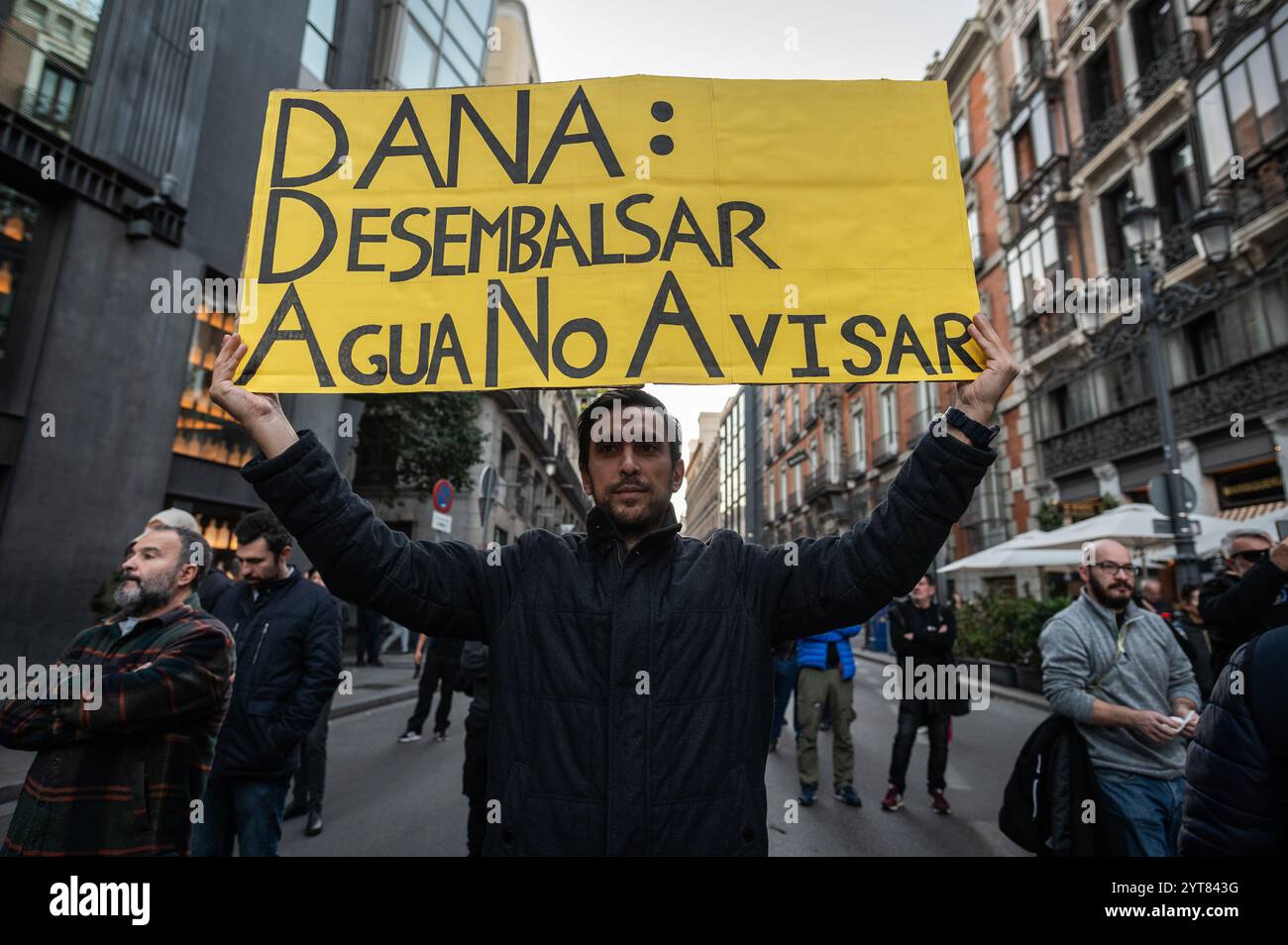 A man protesting with a placard during a demonstration called by Frente ...