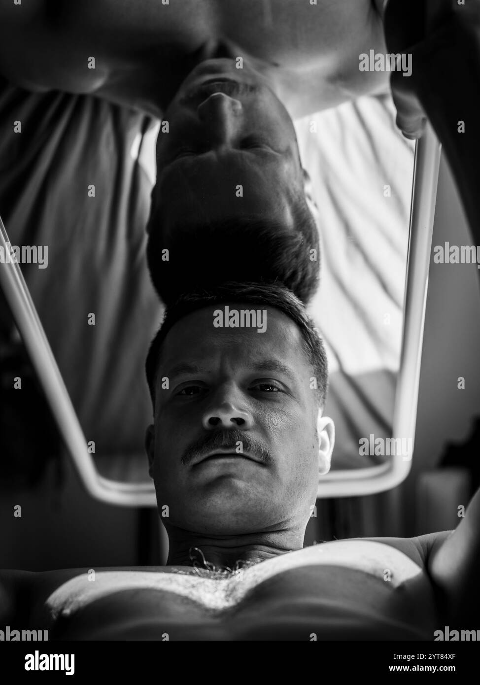 Man lying on bed with a mirror hi-res stock photography and images - Alamy