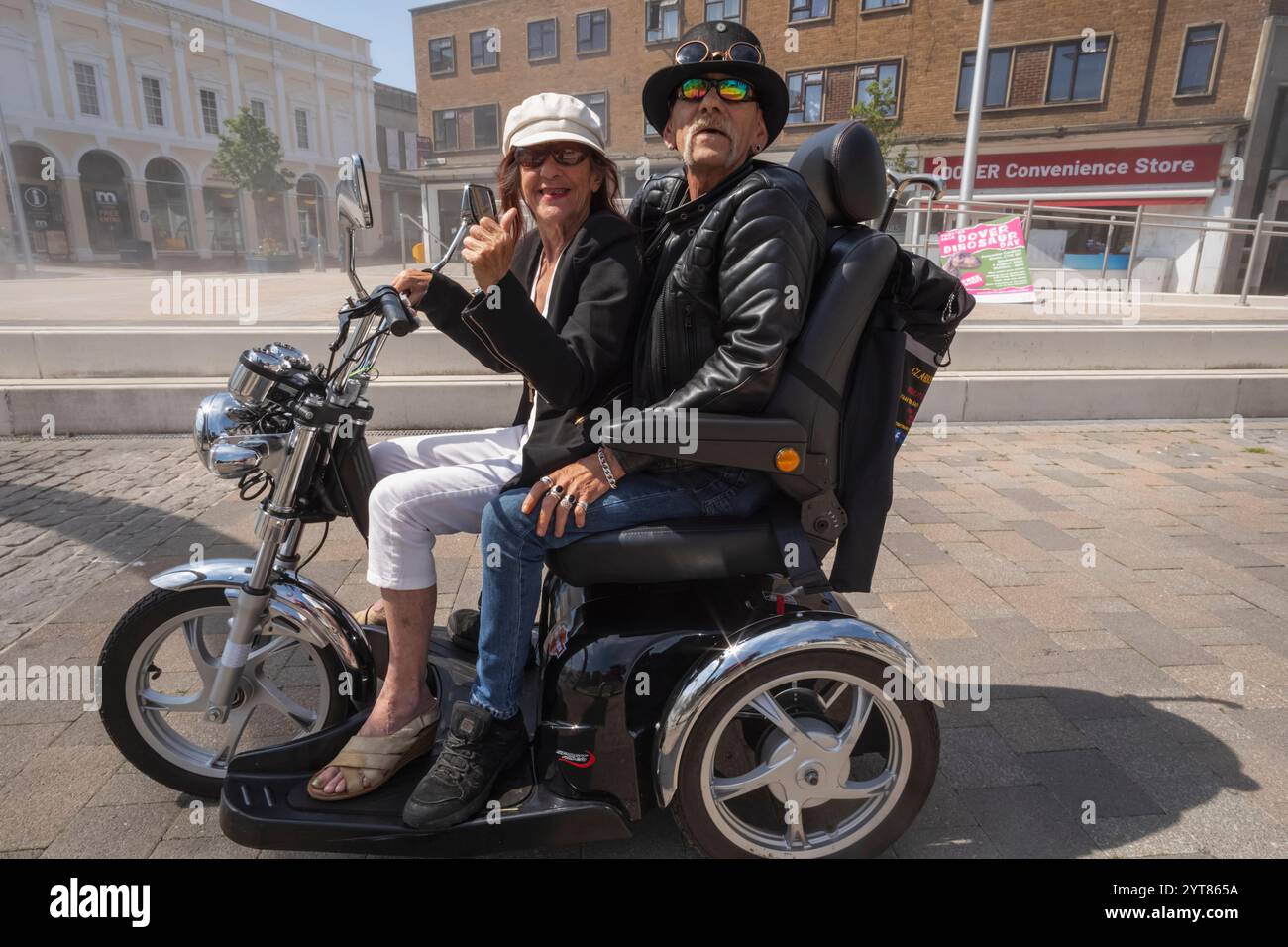 Happy elderly couple on motor scooter hi-res stock photography and ...