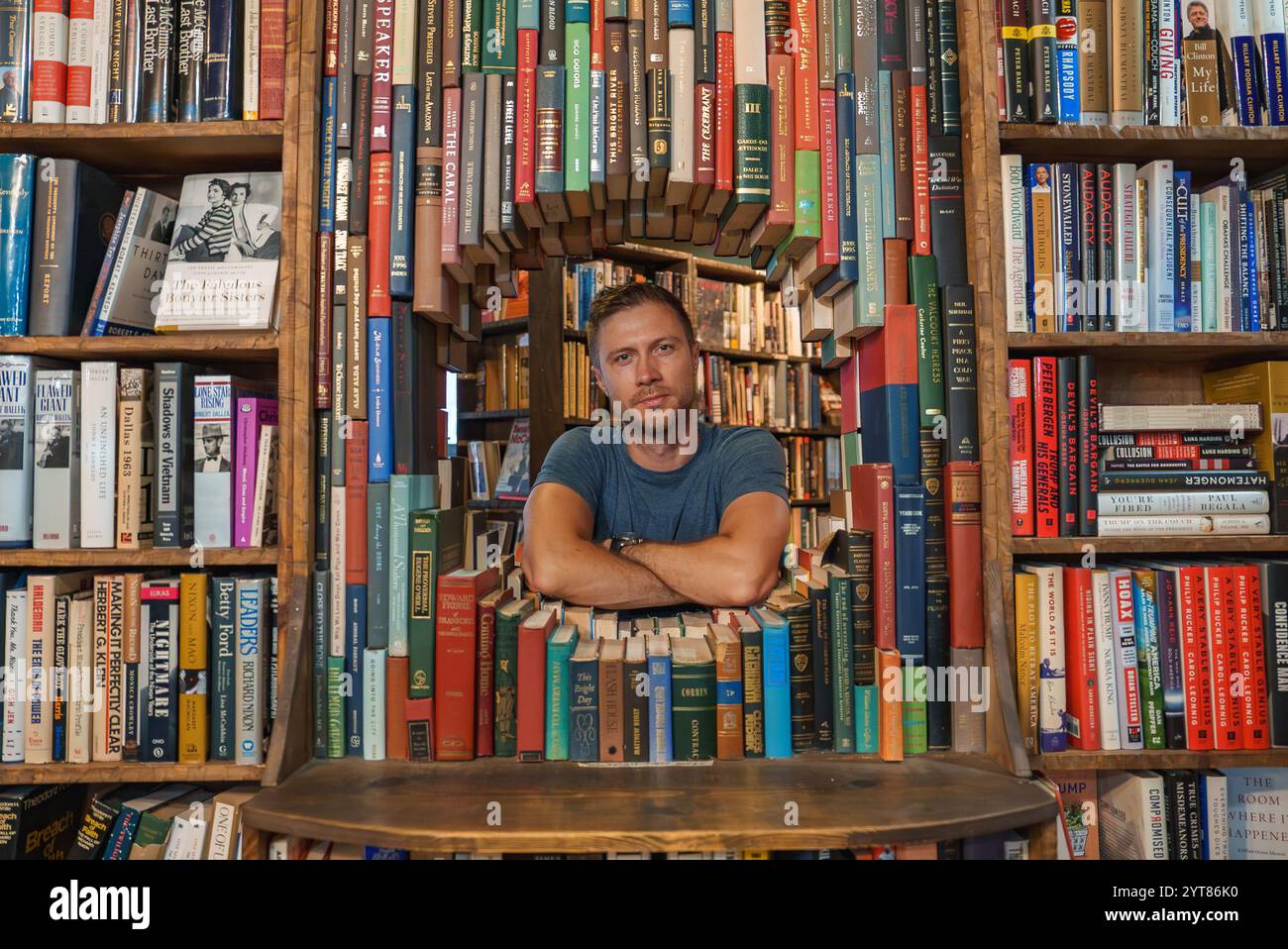 Man Leaning on Circular Book Tunnel at The Last Bookstore, Los Angeles ...