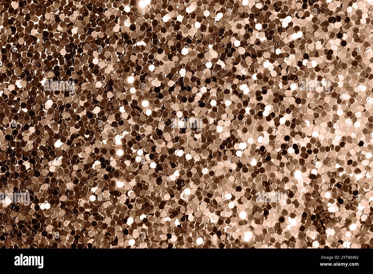 Abstract glitter backdrop featuring sparkling bronze and copper tones ...