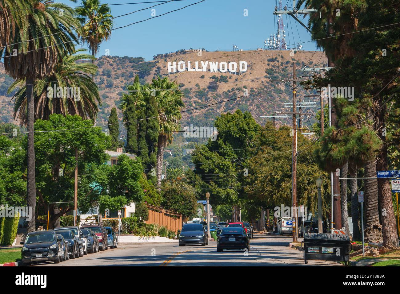 The Hollywood Sign stands prominently on Los Angeles hills, with a palm ...