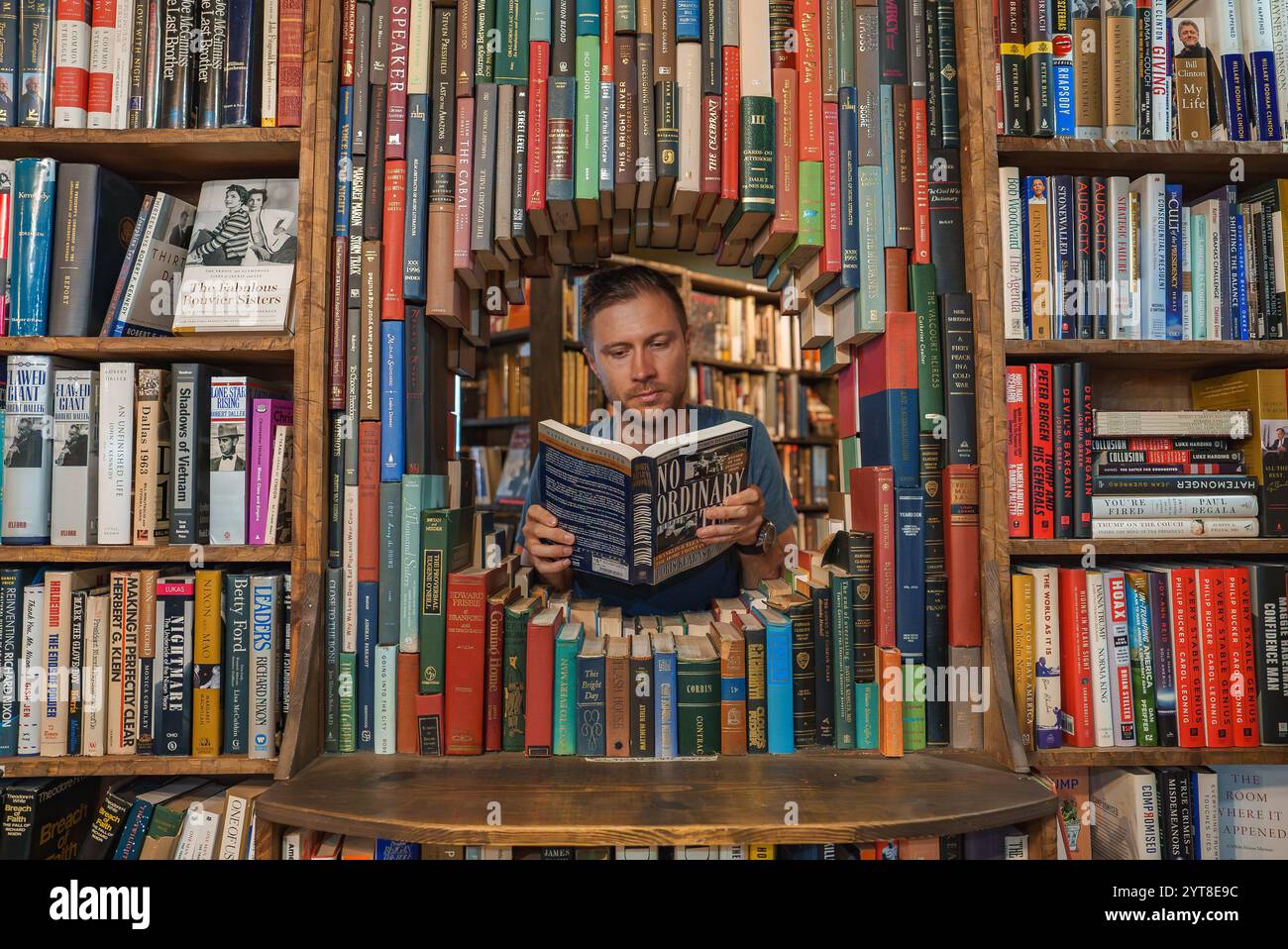 Man Reading in Book Tunnel at The Last Bookstore in Los Angeles Stock ...