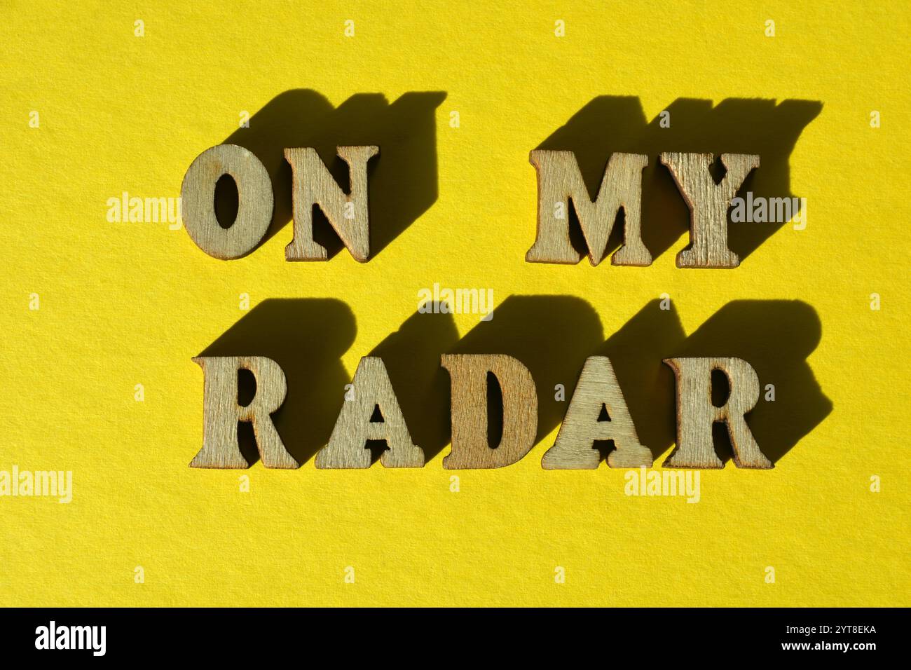 On My Radar, words in wooden alphabet letters isolated on yellow ...