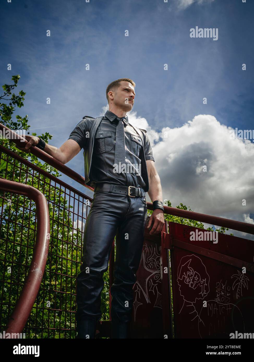 Man in leather outfit on the outside of a building Stock Photo - Alamy