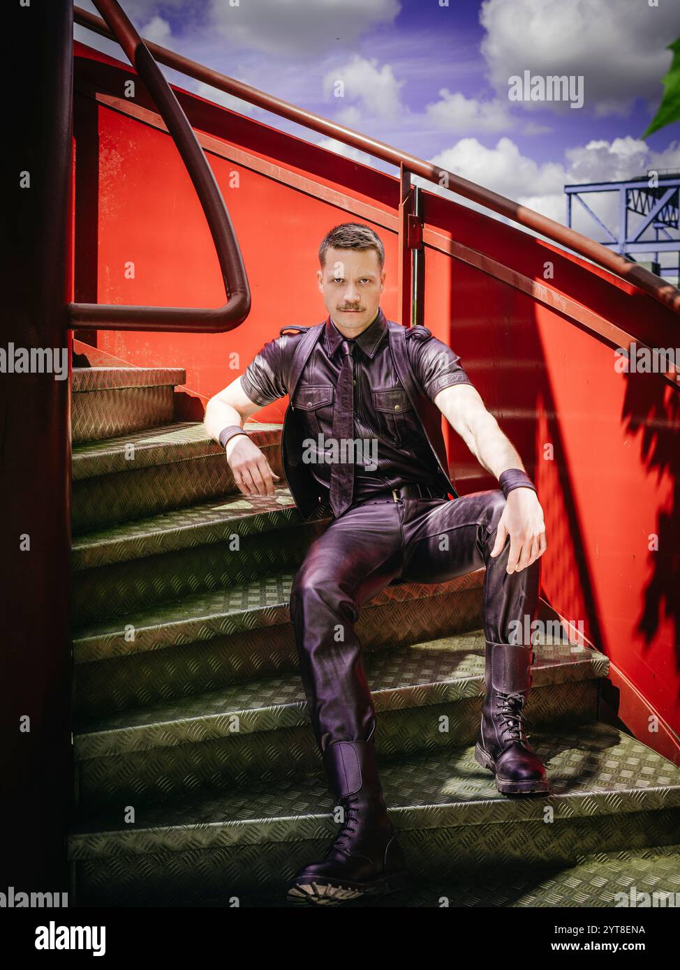 Man in leather outfit on the outside of a building Stock Photo - Alamy