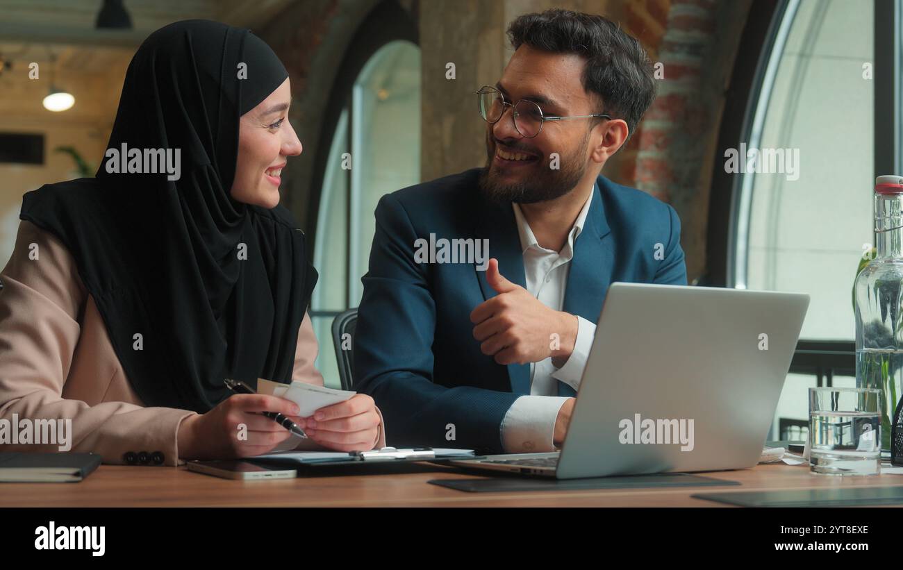 Happy business partners Arabian couple colleagues male female count ...