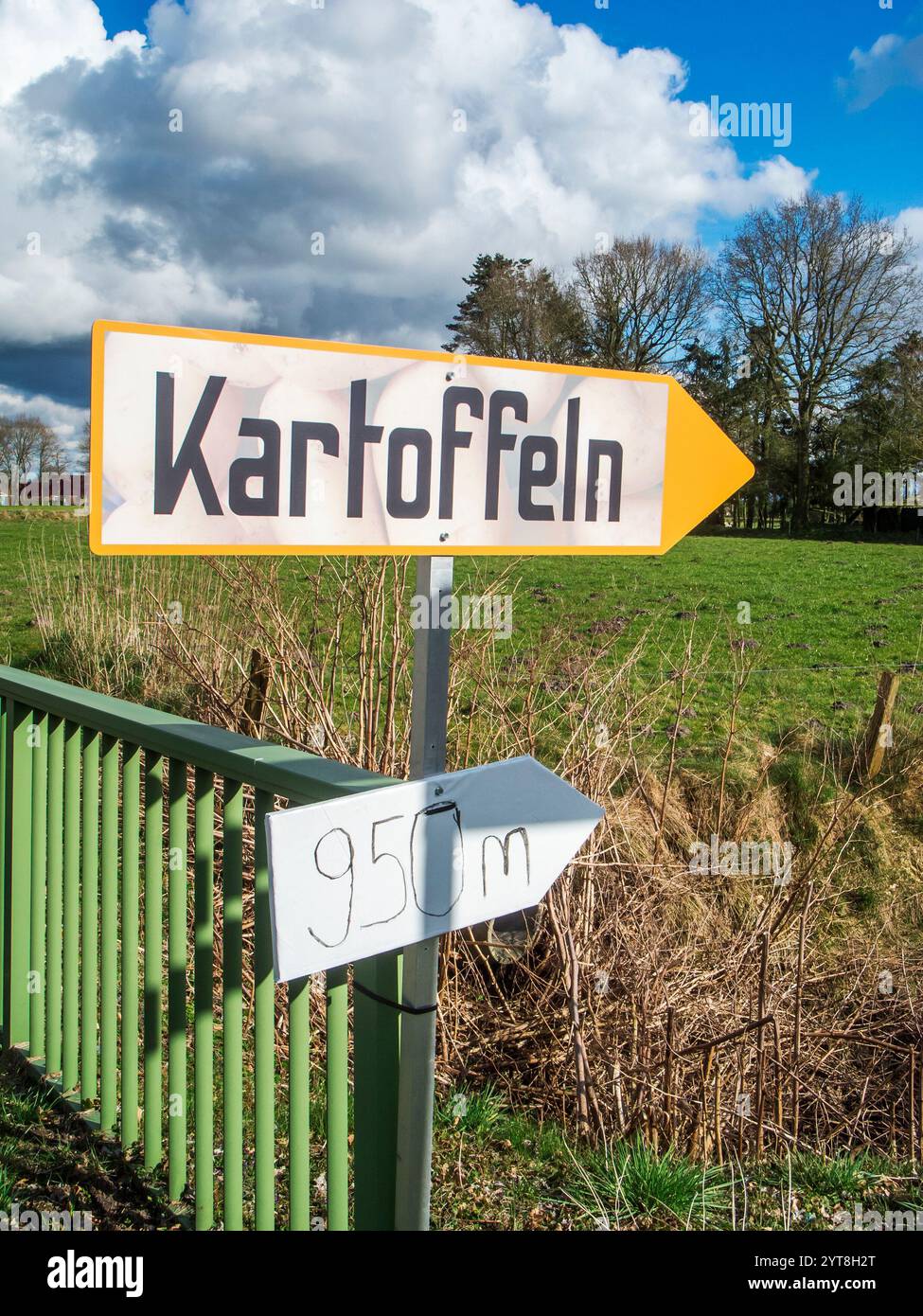 Sign for a potato direct sale on a country road in East Frisia under a ...