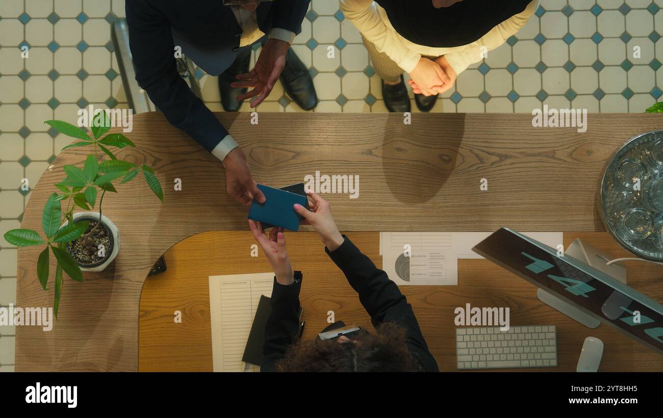 Top view concierge meet guests welcome hotel reception muslim couple ...