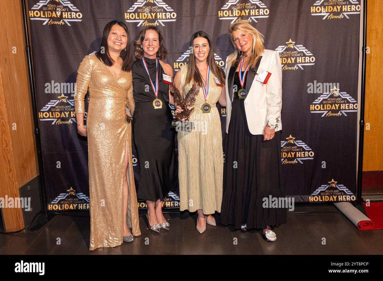 Julie Ziang, Chief Revenue Officer of Merlin Cyber, presents Niki Lane ...