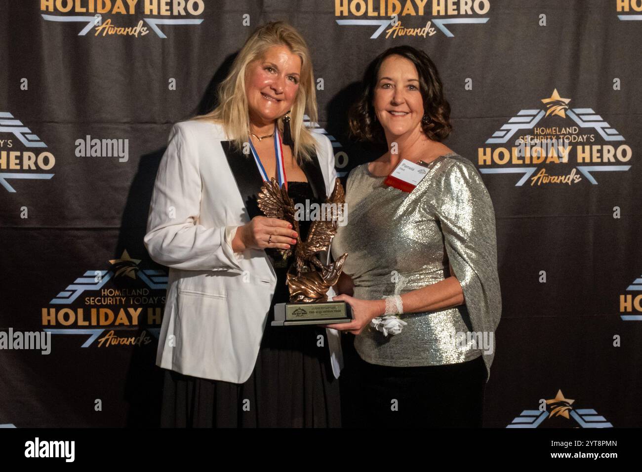 Niki Lane and Pamela Elliott accept the Acquisition Excellence - Federal Award during The ...