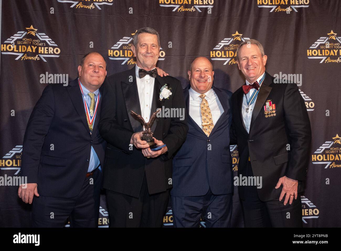 Members of Seebald & Associates International pose with a Mission Award ...