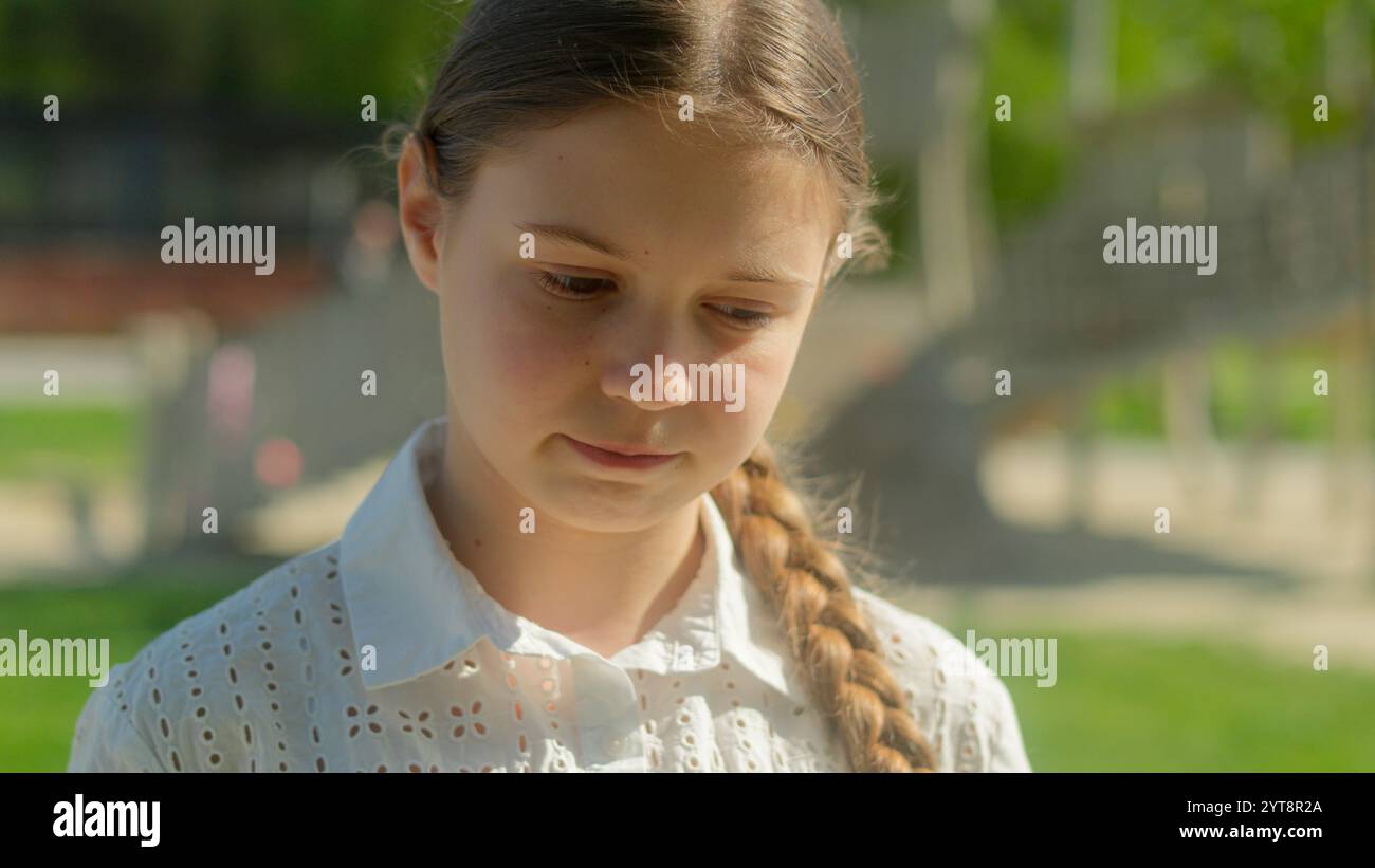 Sad alone pensive serious little girl child Caucasian adopted kid ...