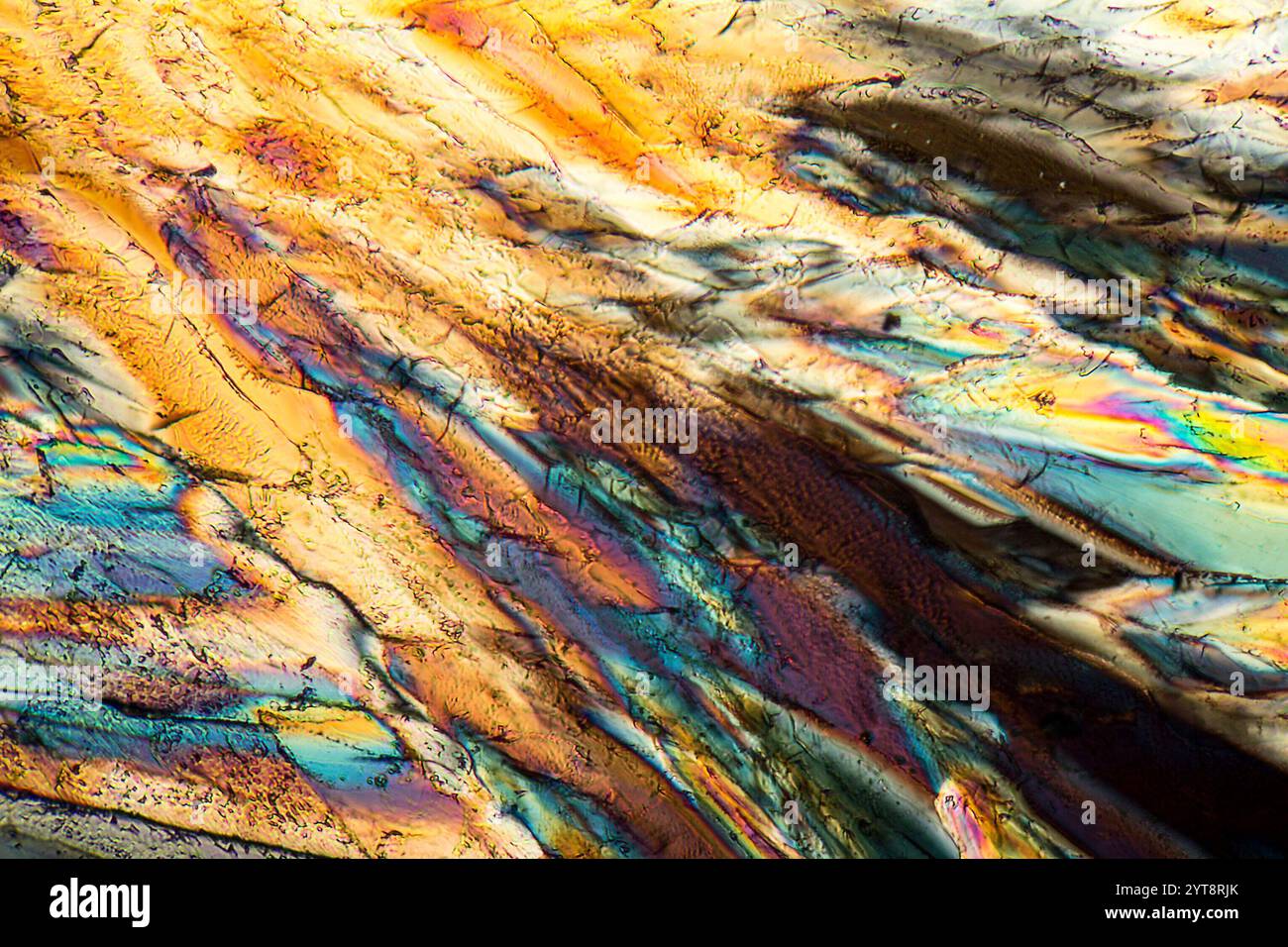Colorful microscopic shot of sucrose micro crystals in polarized light ...