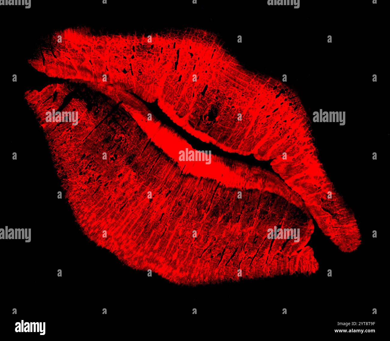 Red print of kissing lips in black back Stock Photo - Alamy