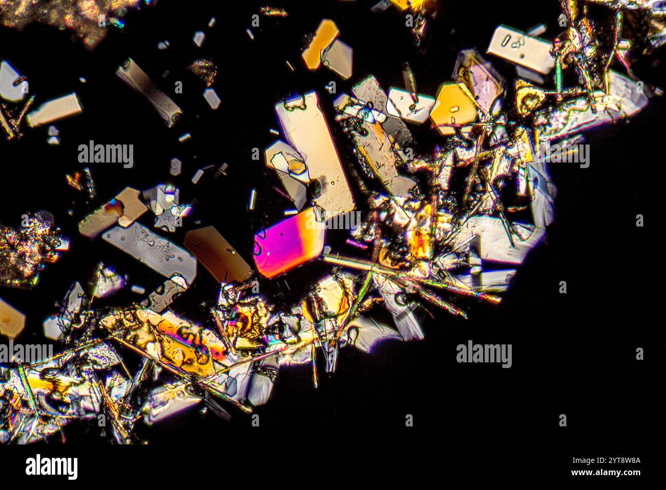 Microscopic shot showing colorful microcrystals in polarized light ...