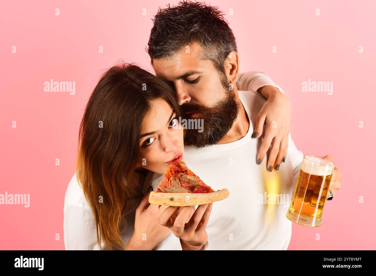 Loving couple biting pizza hi-res stock photography and images - Alamy
