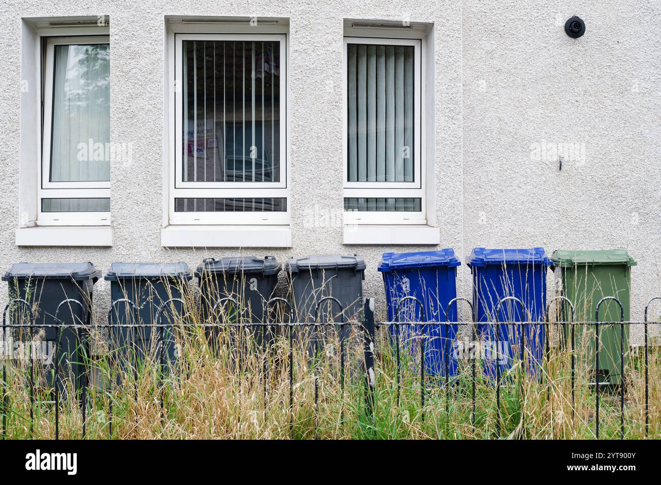 Wheelie bins in row for refuge collection outdoors Stock Photo - Alamy