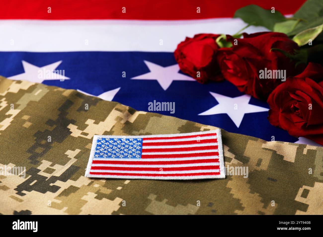 Veterans day. USA army patch, rose flowers and military uniform on ...