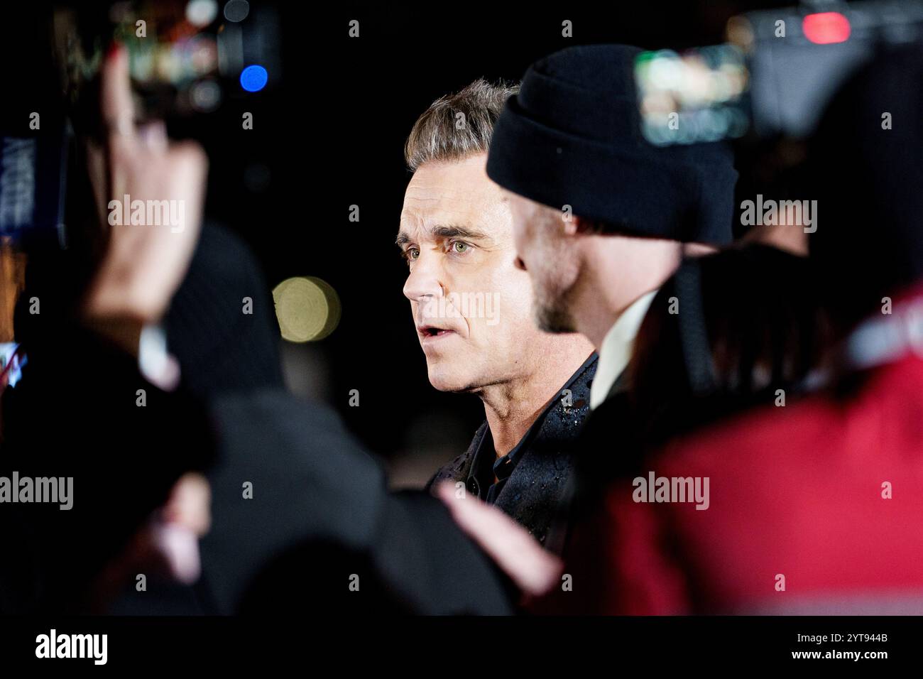 ROME, ITALY - Robbie Williams and Michael Gracey attend the premiere of ...