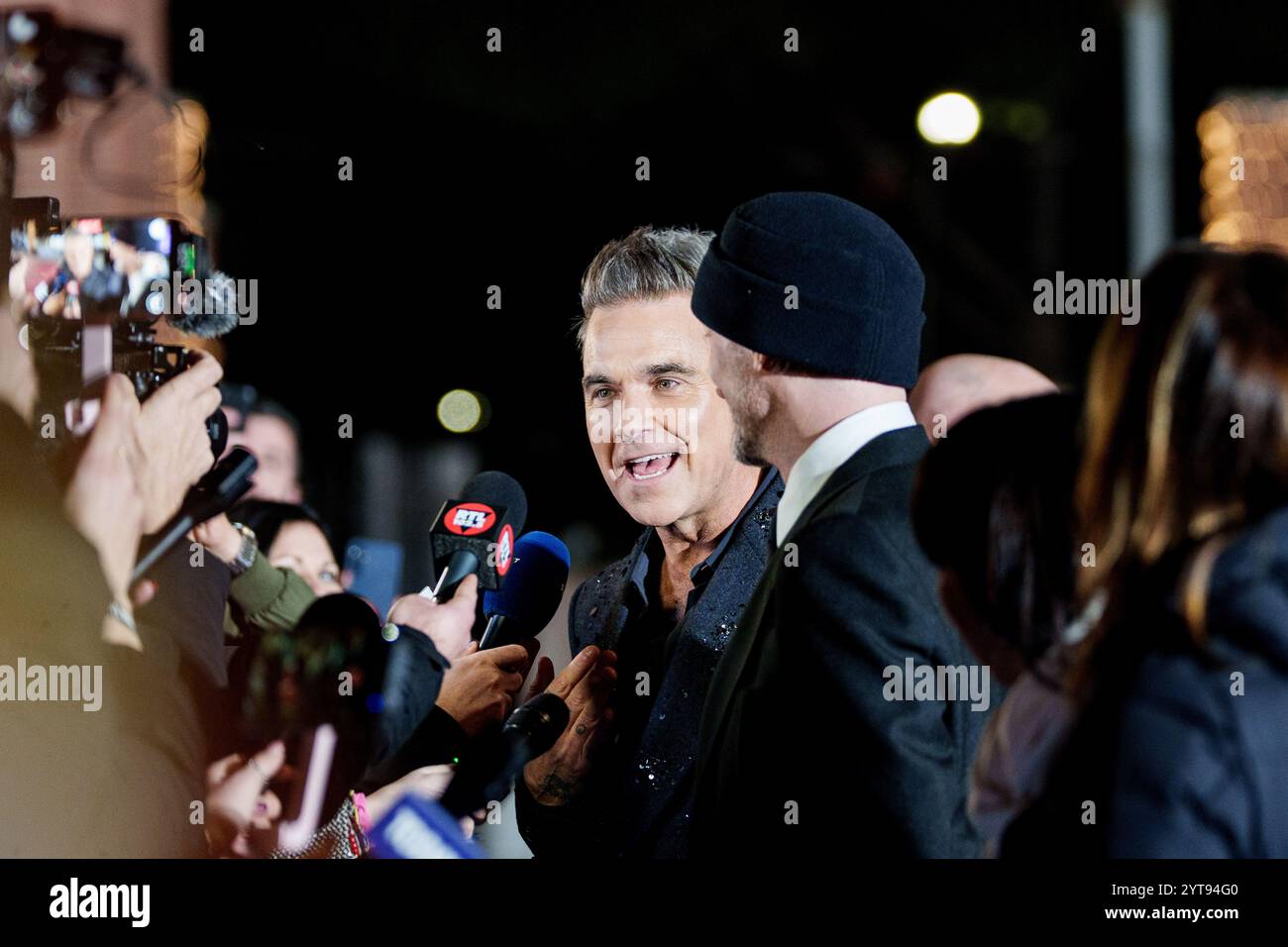 ROME, ITALY - Robbie Williams and Michael Gracey attend the premiere of ...