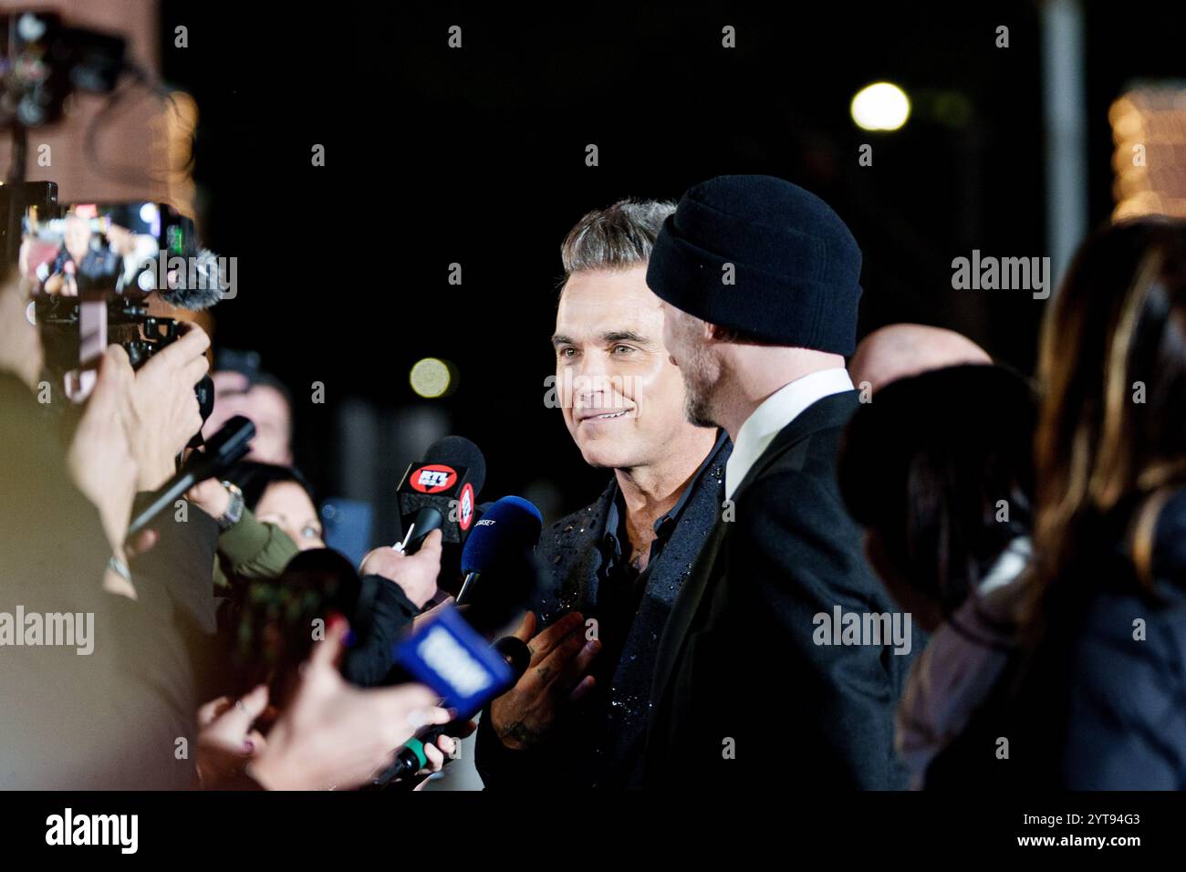 ROME, ITALY - Robbie Williams and Michael Gracey attend the premiere of ...