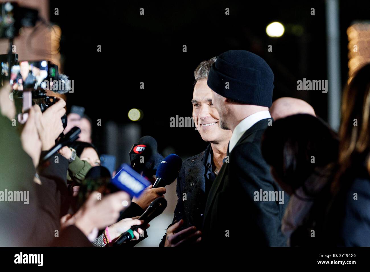 ROME, ITALY - Robbie Williams and Michael Gracey attend the premiere of ...