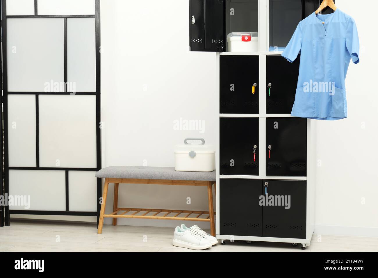 Medical personnel uniform on locker in changing room Stock Photo - Alamy