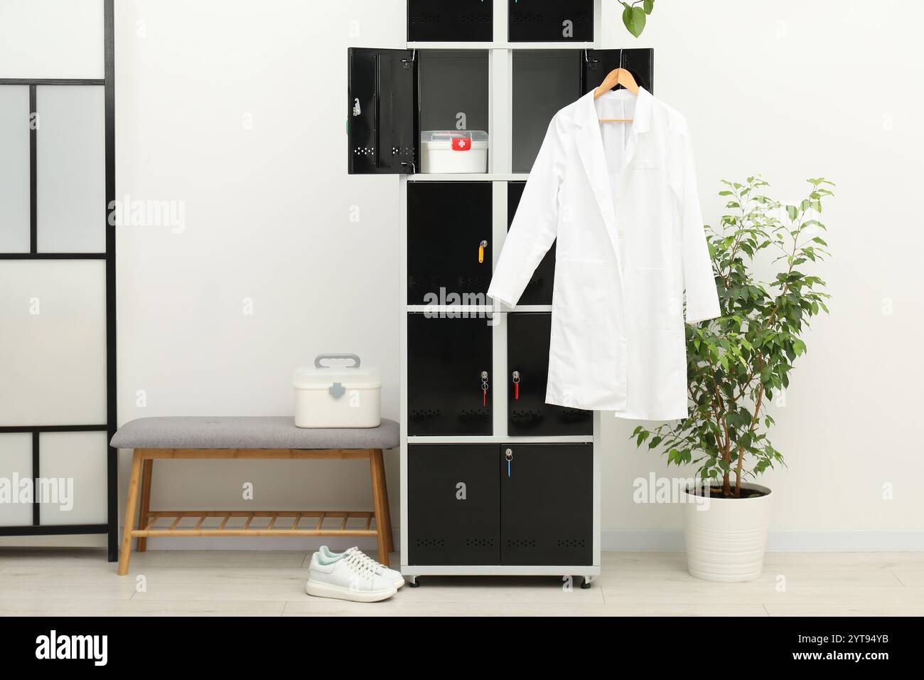 Medical personnel uniform on locker in changing room Stock Photo - Alamy