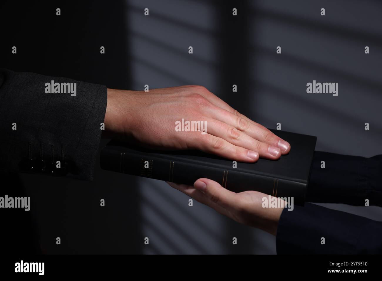 Man taking oath with his hand on Bible indoors, closeup Stock Photo - Alamy
