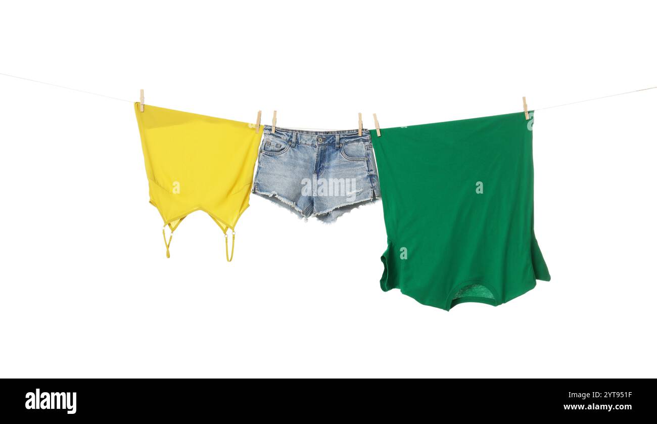Different clothes drying on laundry line against white background Stock ...