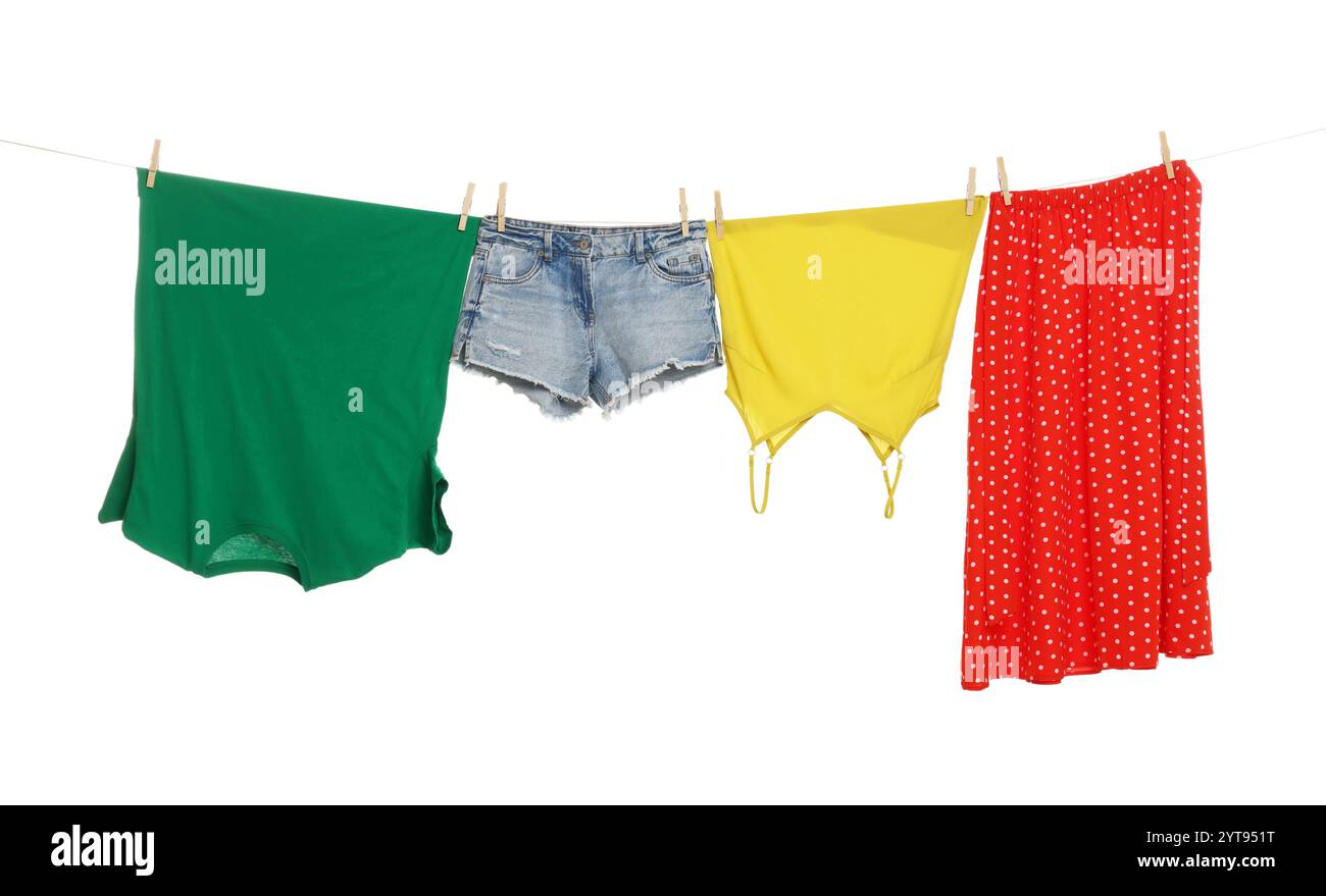 Different clothes drying on laundry line against white background Stock ...