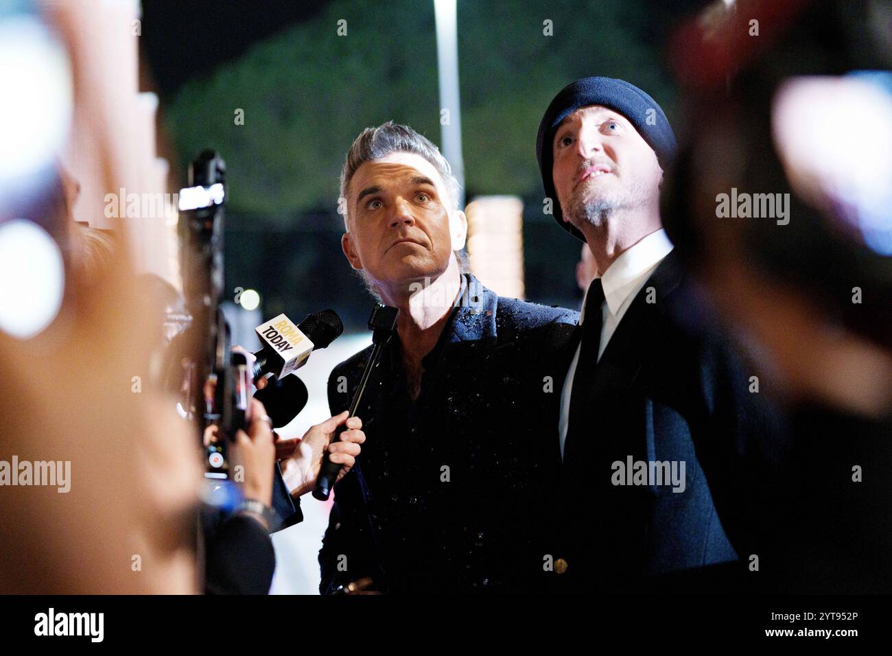 ROME, ITALY - Robbie Williams and Michael Gracey attend the premiere of ...