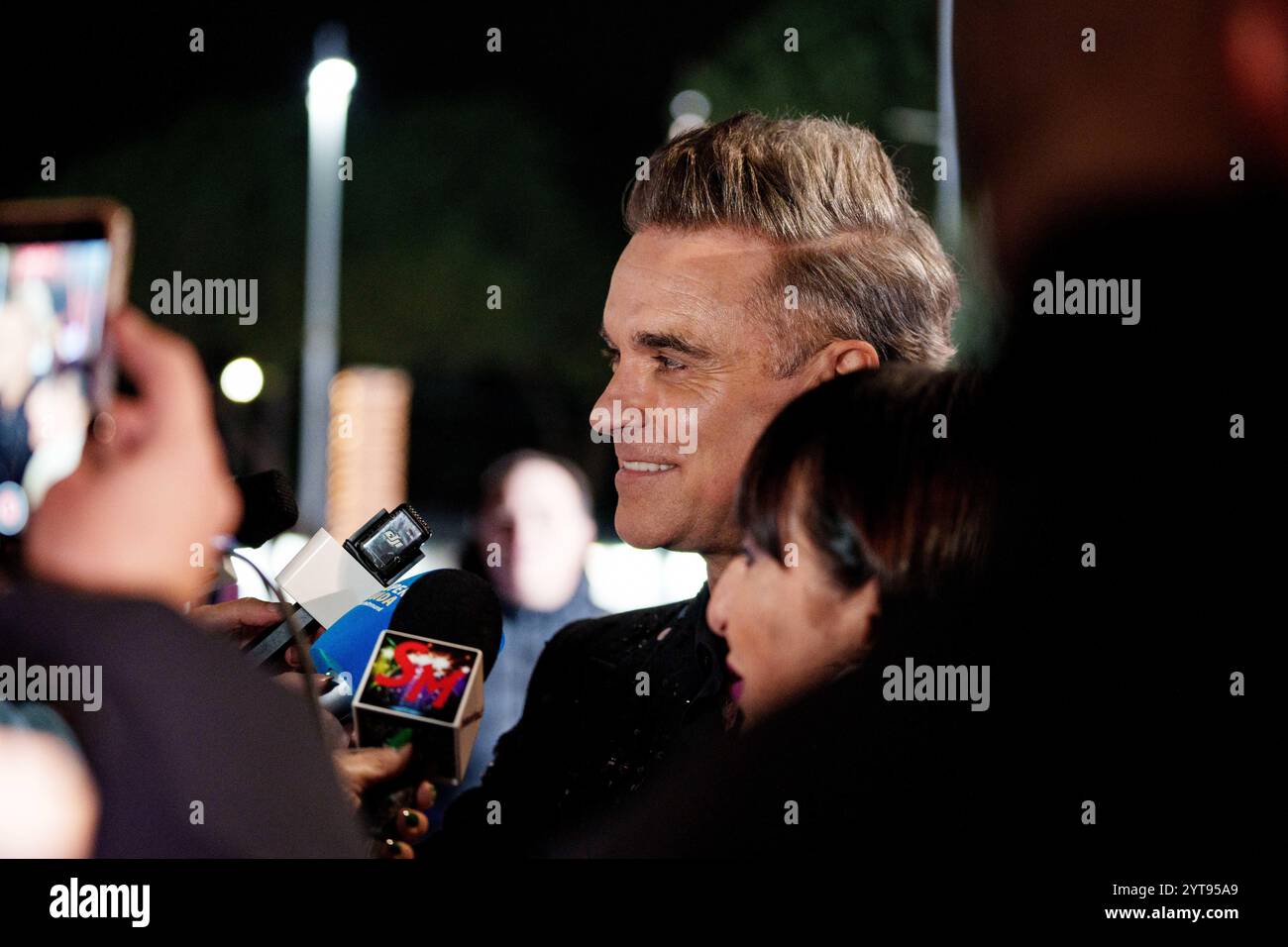 ROME, ITALY - Robbie Williams and Michael Gracey attend the premiere of ...