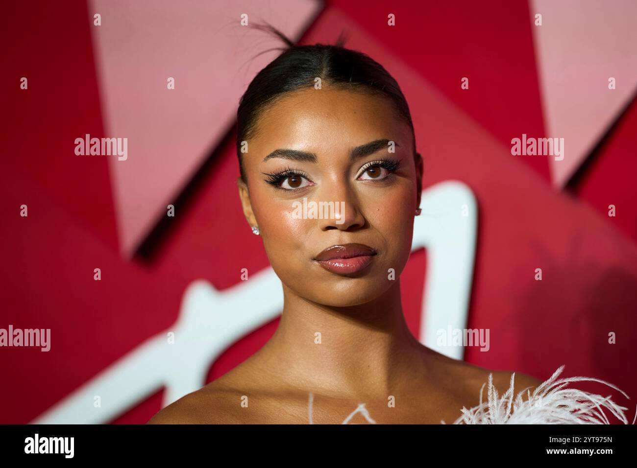 Uma Jammeh poses for photographers upon arrival at The Fashion Awards ...