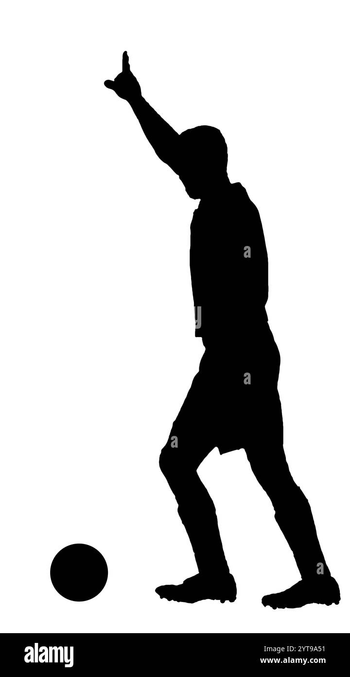 Soccer player silhouette cut out on white while shooting a soccer ball ...