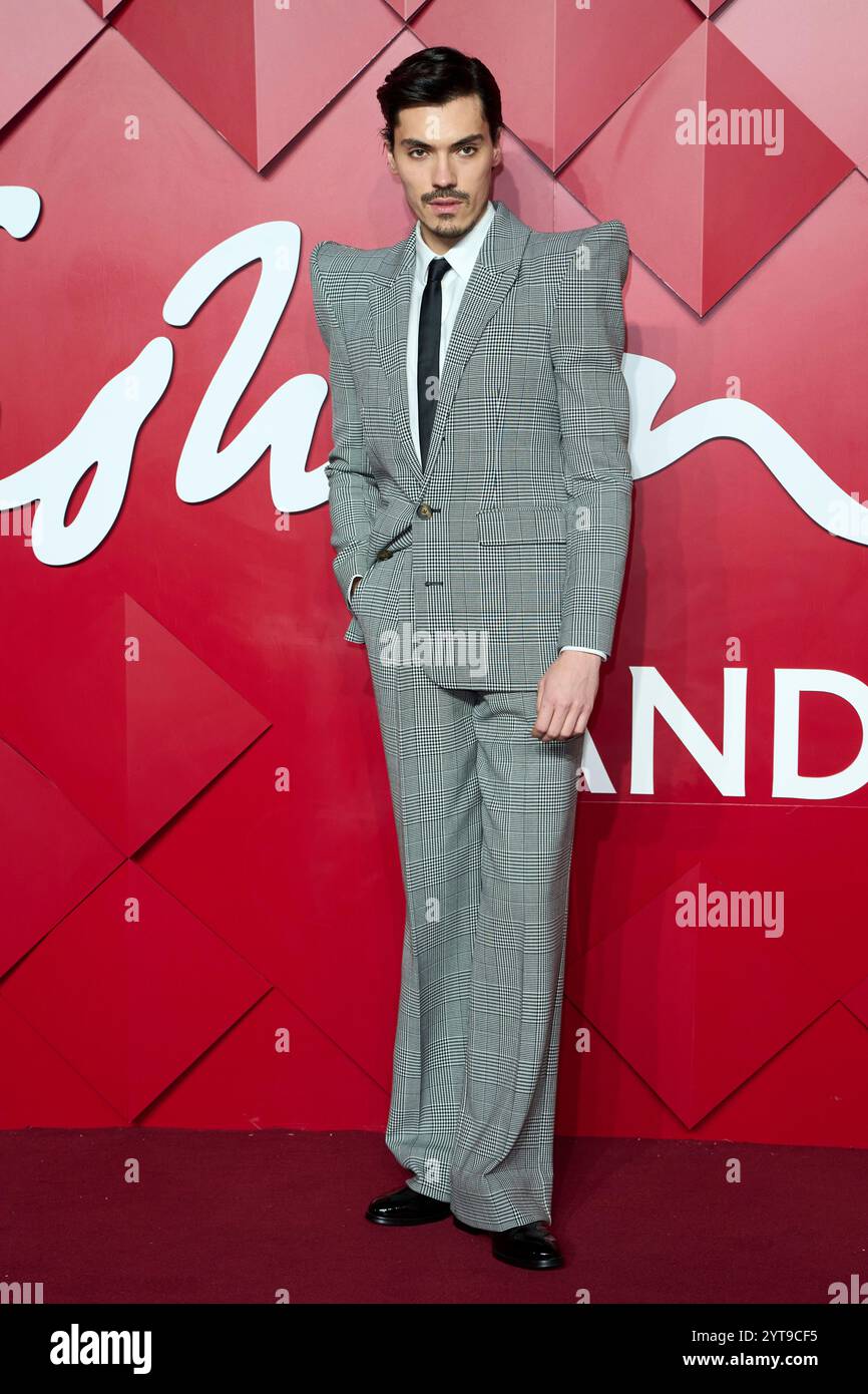 Lyas Medini poses for photographers upon arrival at The Fashion Awards ...