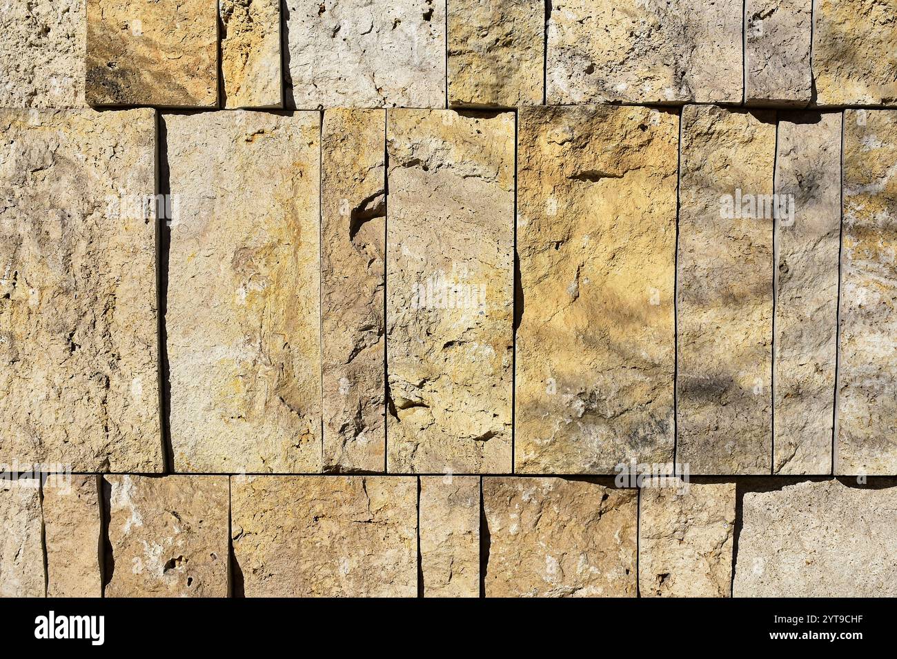 Facade made of natural stones Stock Photo - Alamy