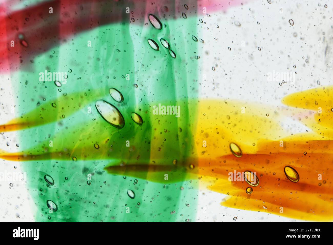 Air bubbles and colored glass in a glass object Stock Photo - Alamy