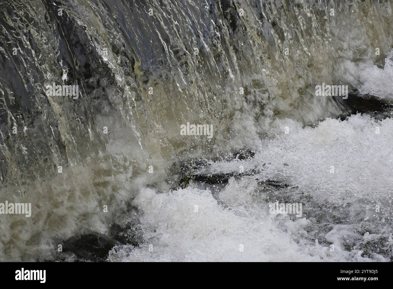 Spray on a water cascade Stock Photo - Alamy