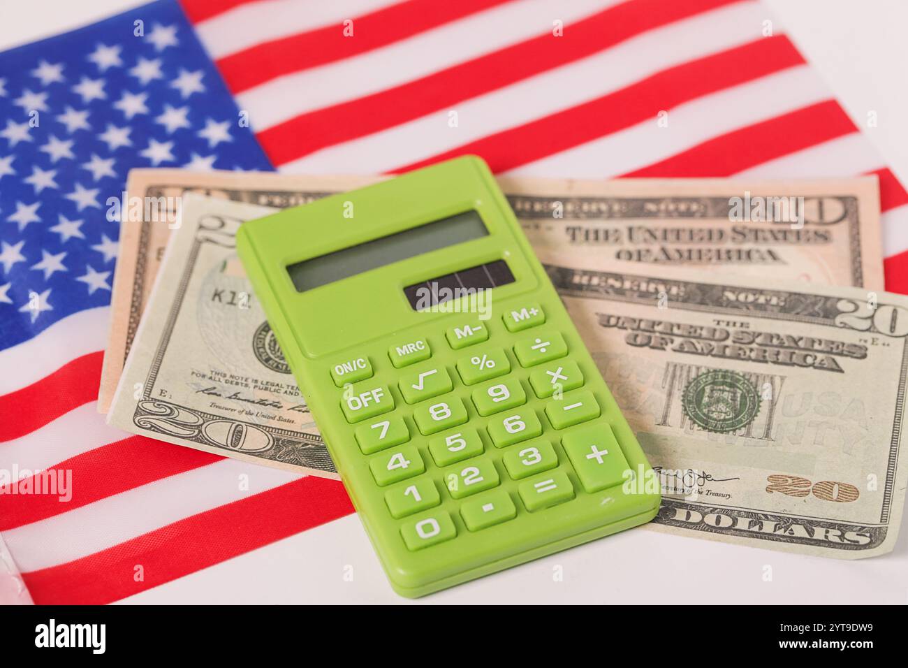 USA American flag, calculator and dollars. Calculating expenses concept ...