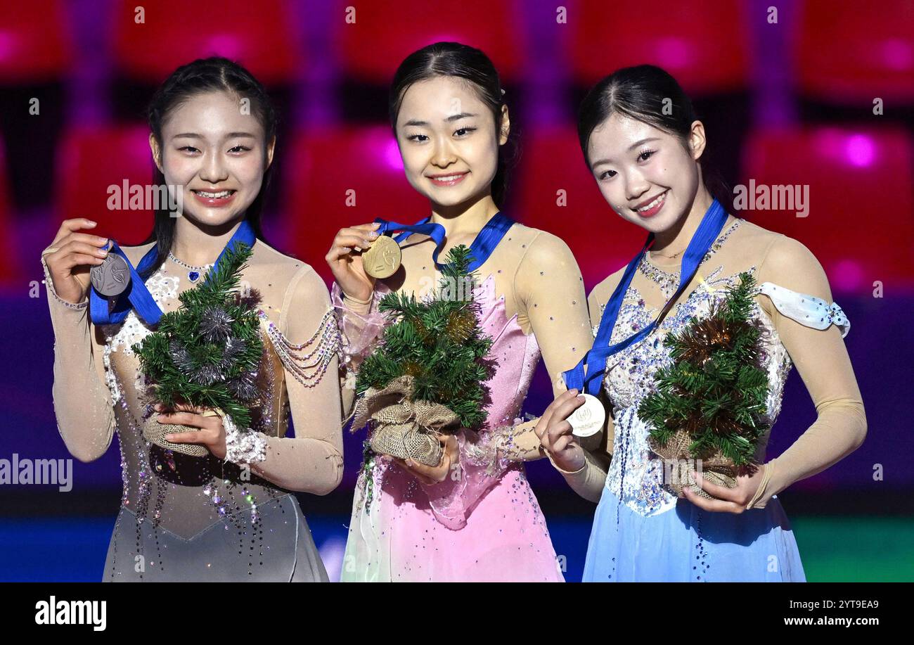 (L-R) Kaoruko Wada of Japan, Mao Shimada of Japan, Ami Nakai of Japan celebrate during an award ...