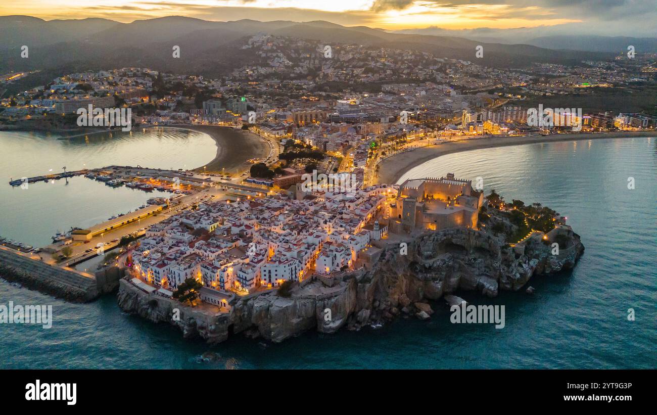 Aerial view of Peniscola town and castle at twilight on Costa del ...