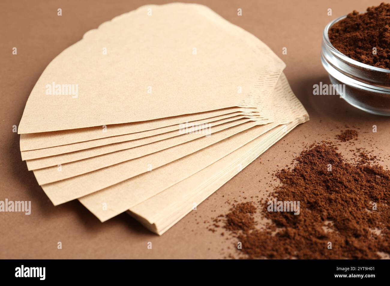 Paper filters and instant coffee on brown background, closeup Stock ...