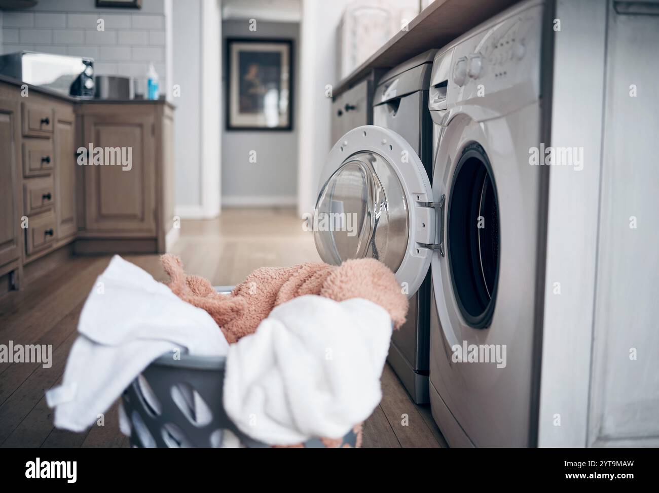 Empty room, laundry and clothes by washing machine for housekeeping ...